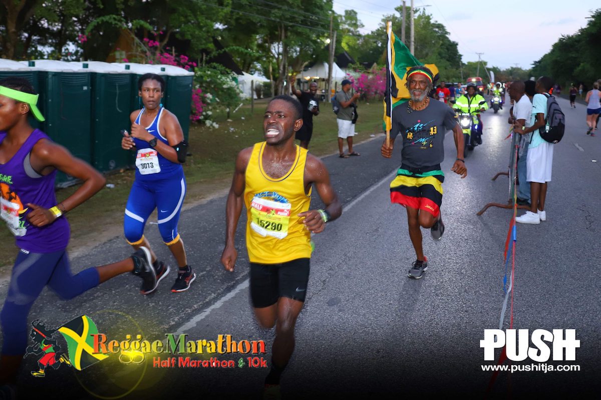 Runners spotted along the course of the Reggae Marathon in Negril ...